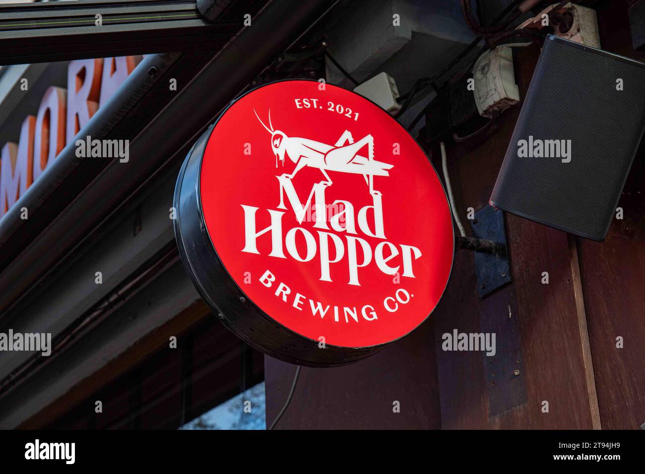 Mad Hopper Brewing Co. cabinet sign on Viisi Penniä restaurant wall in ...