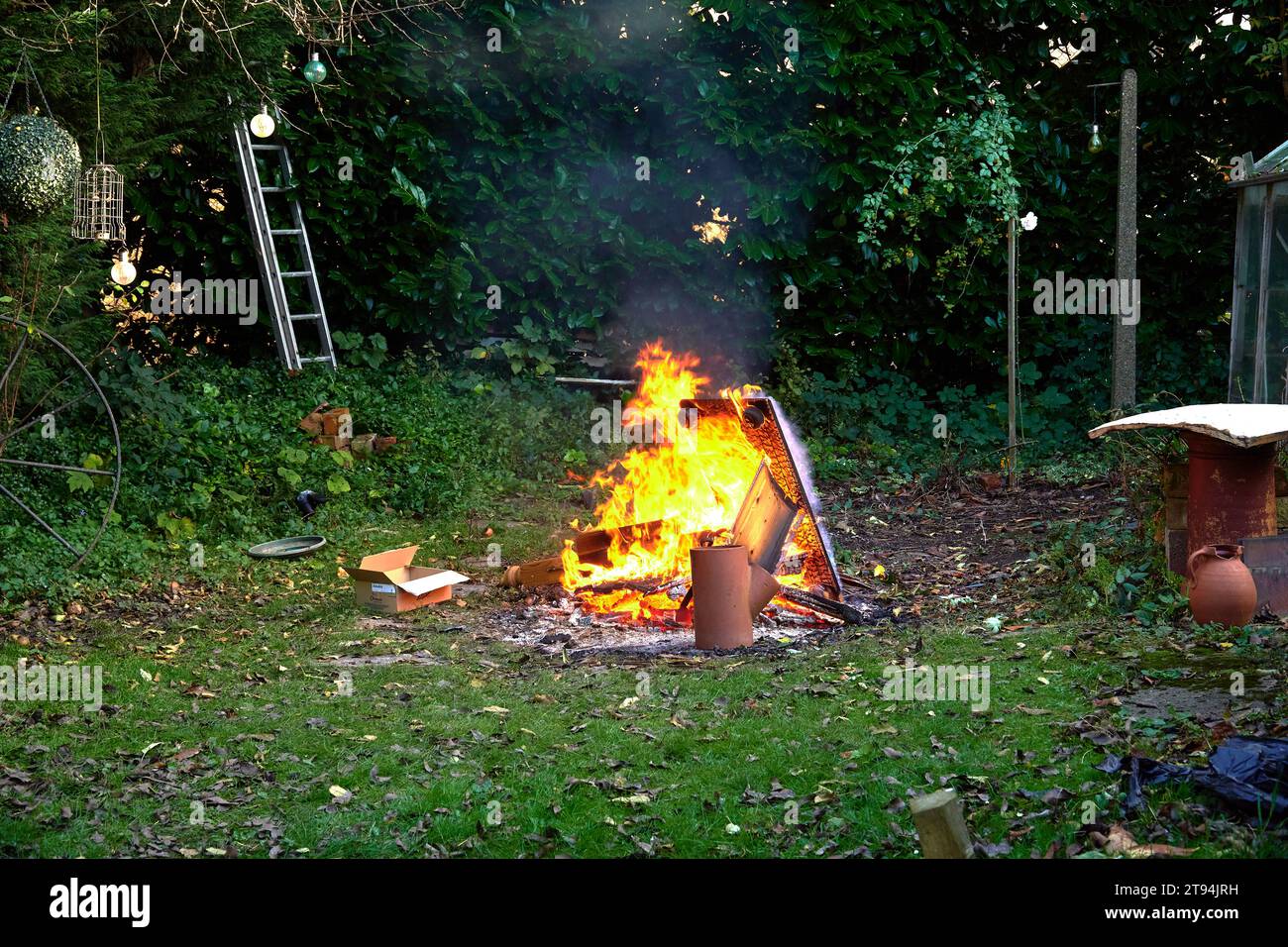 Wood burning on a garden bonfire Stock Photo - Alamy