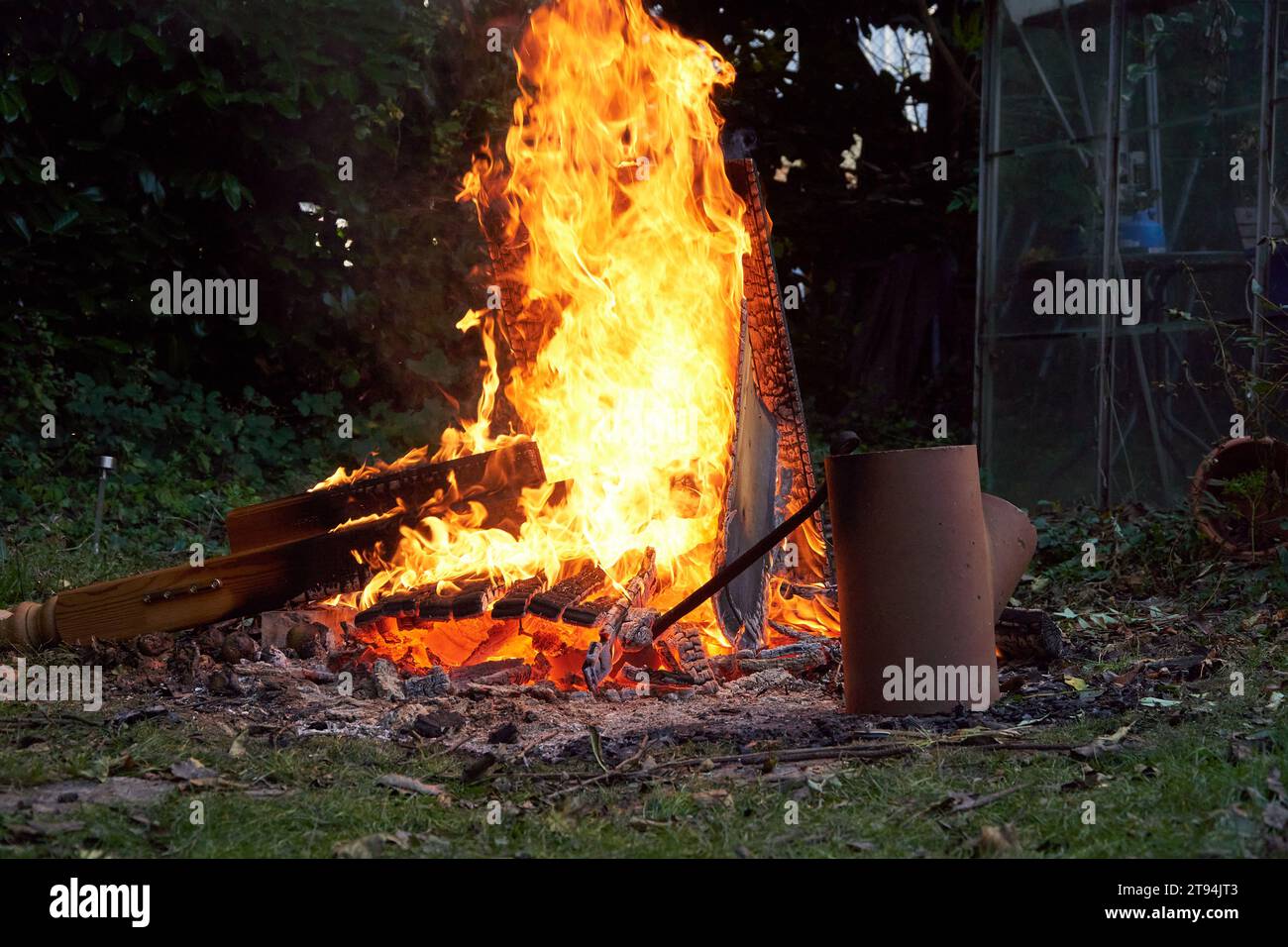 Wood burning on a garden bonfire Stock Photo - Alamy