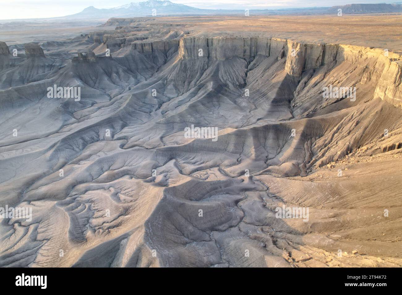 An expansive sandy desert landscape with a stunning beauty, devoid of ...