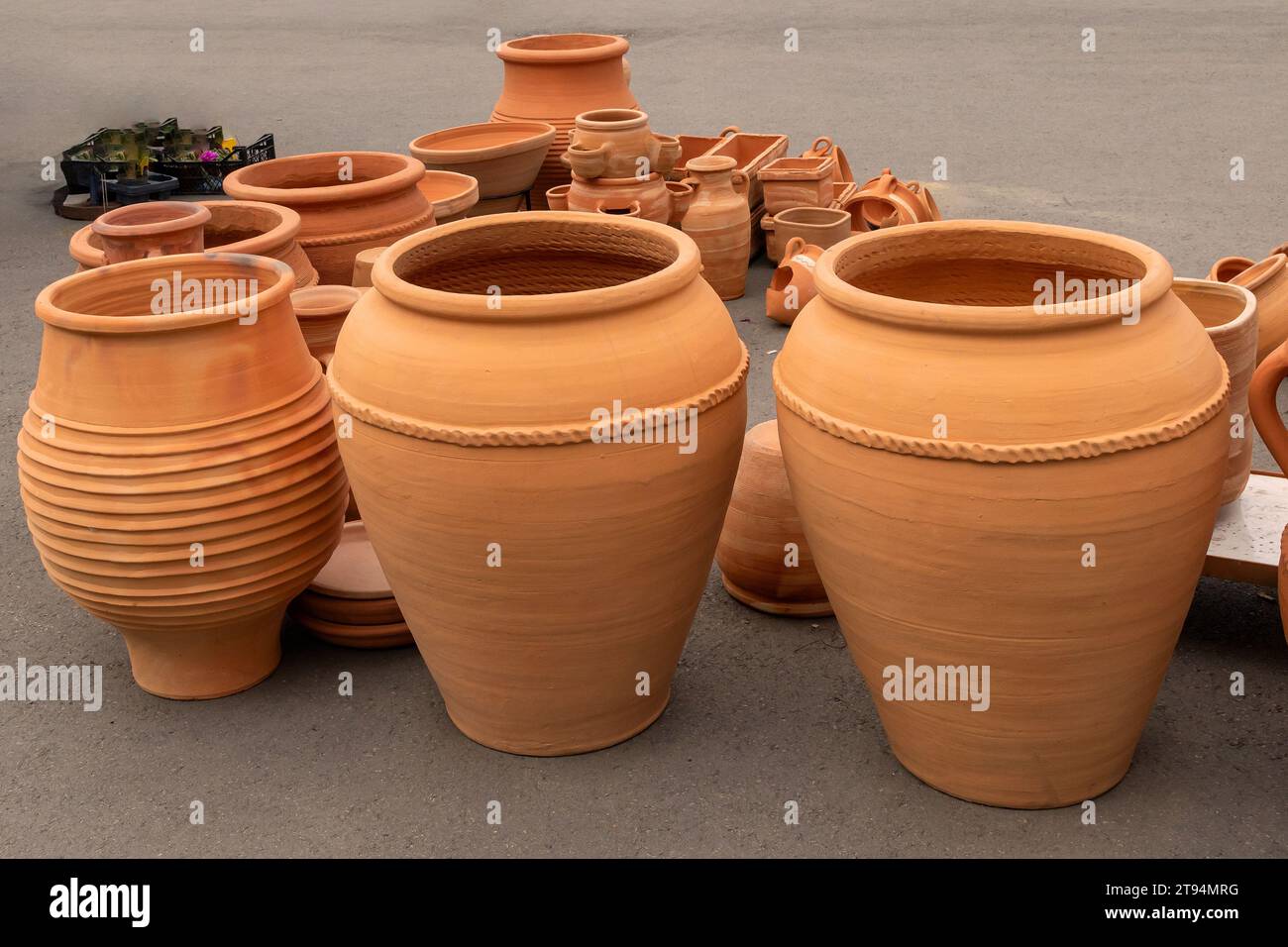 Handmade earth ware pots on street ground outside Stock Photo - Alamy