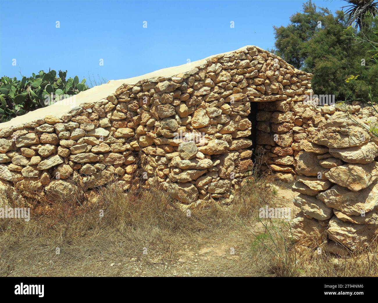 houses built with dry stone walls typical of the warm Mediterranean ...