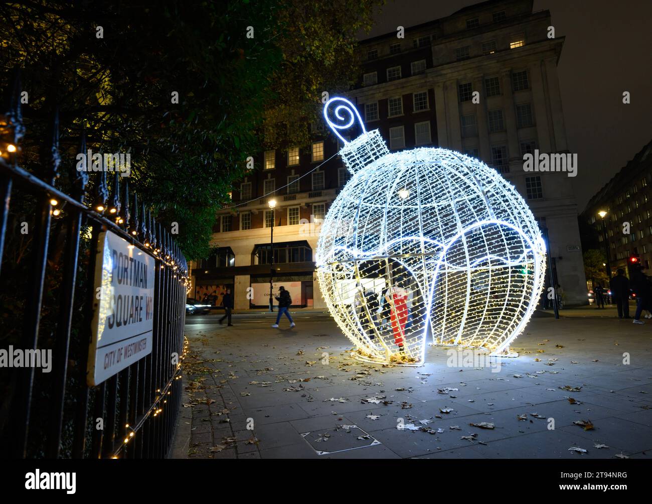 EDITORIAL USE ONLY Members of the public view a glittering bauble on ...