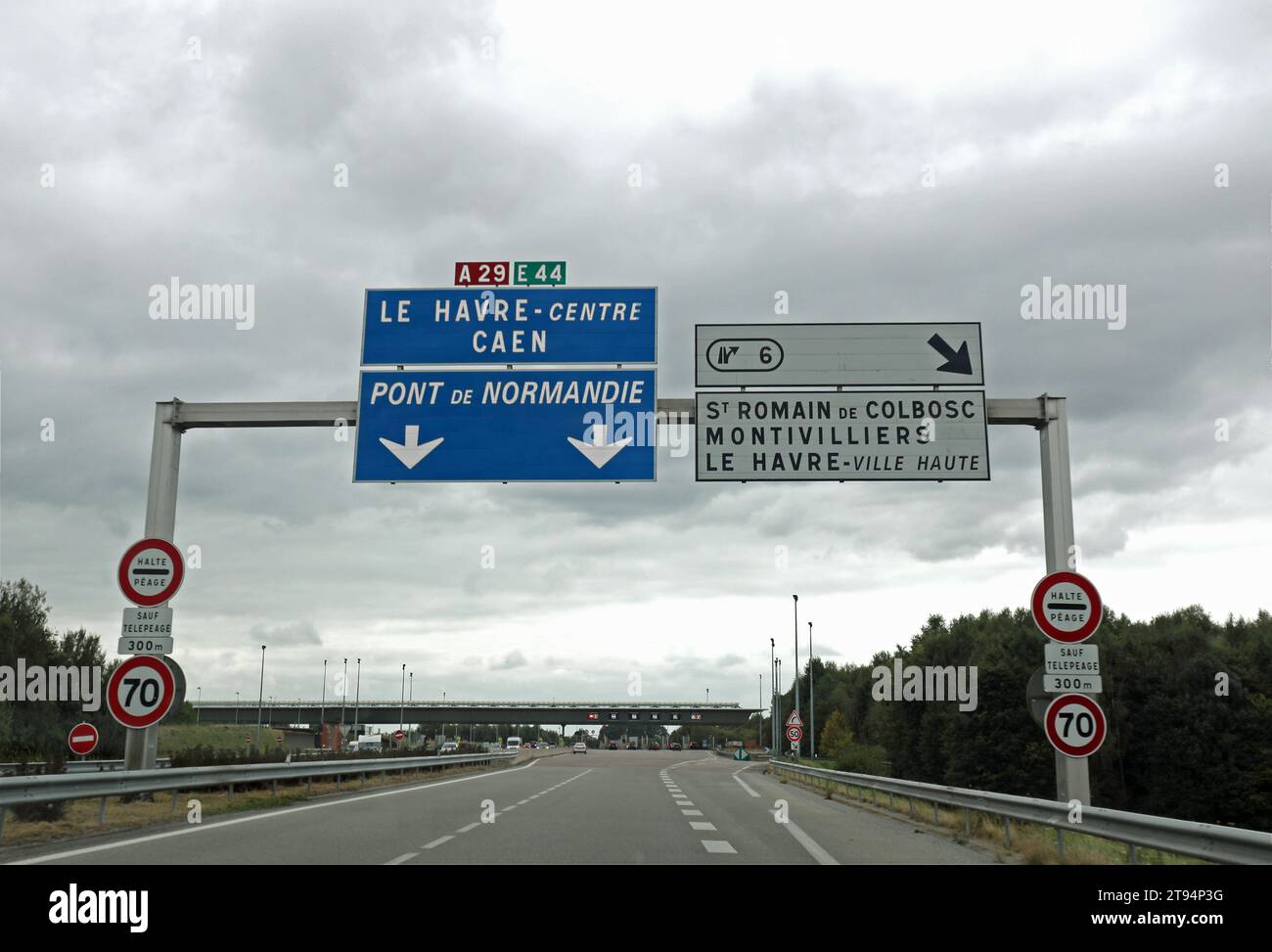 large road sign with French locations to go to the city of Le Havre or ...