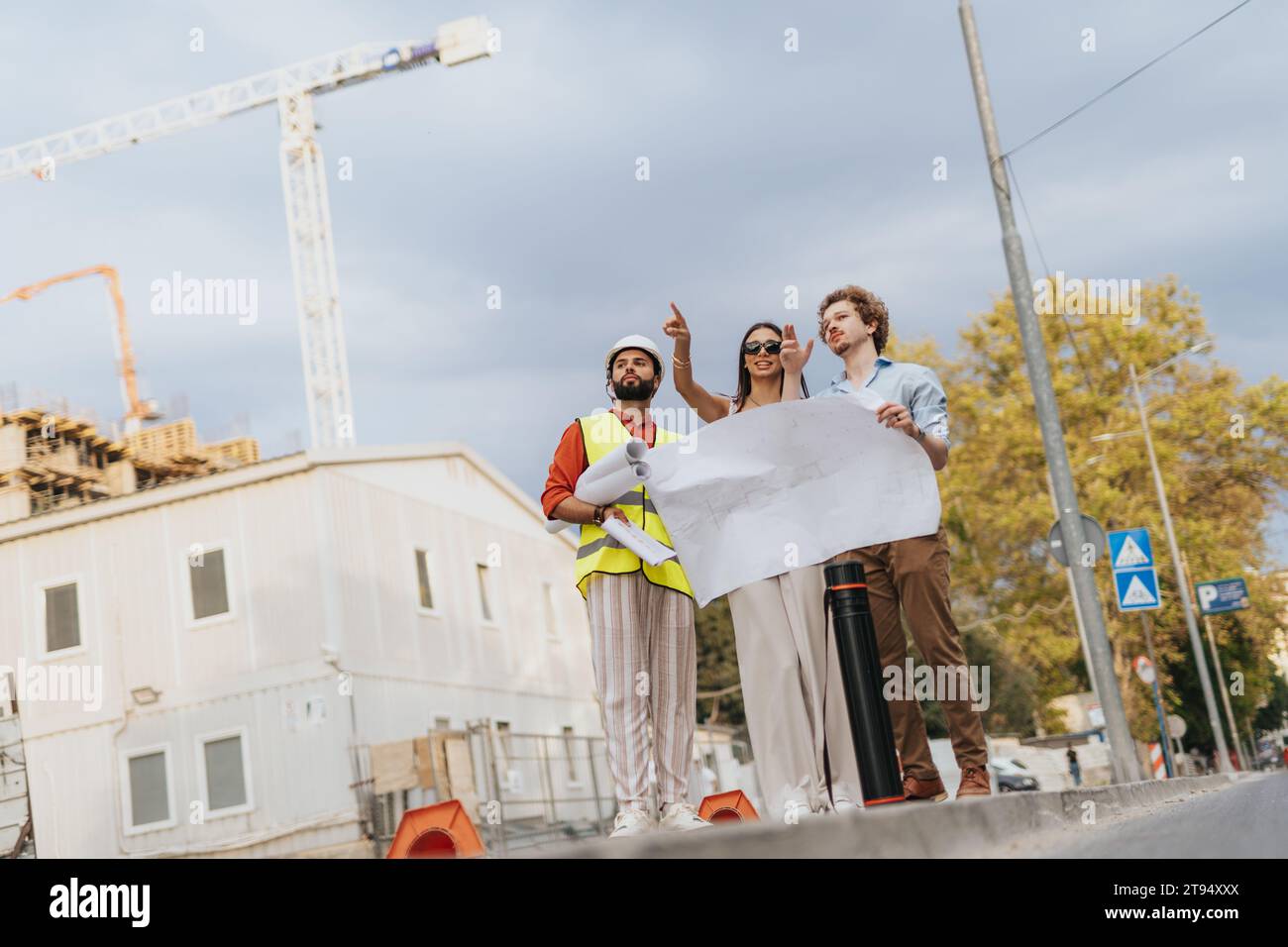 Corporate Team Collaborating on Sustainable Design for New Urban ...