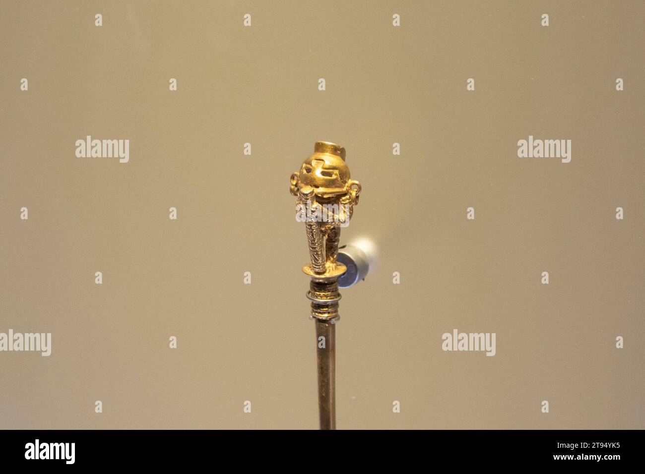 Indigenous golden small figure of a chaman playing flute Stock Photo ...