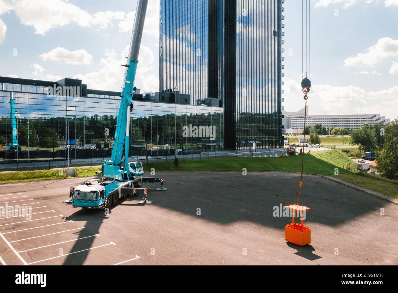 view from the height of the car of a heavy crane with a cradle, which ...