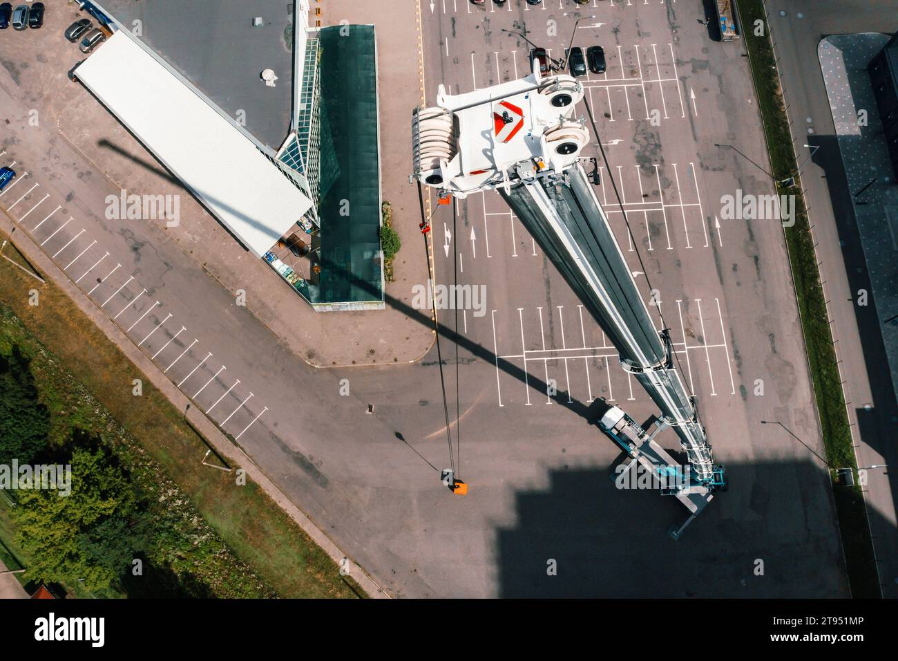 view from the height of the car of a heavy crane with a cradle, which ...