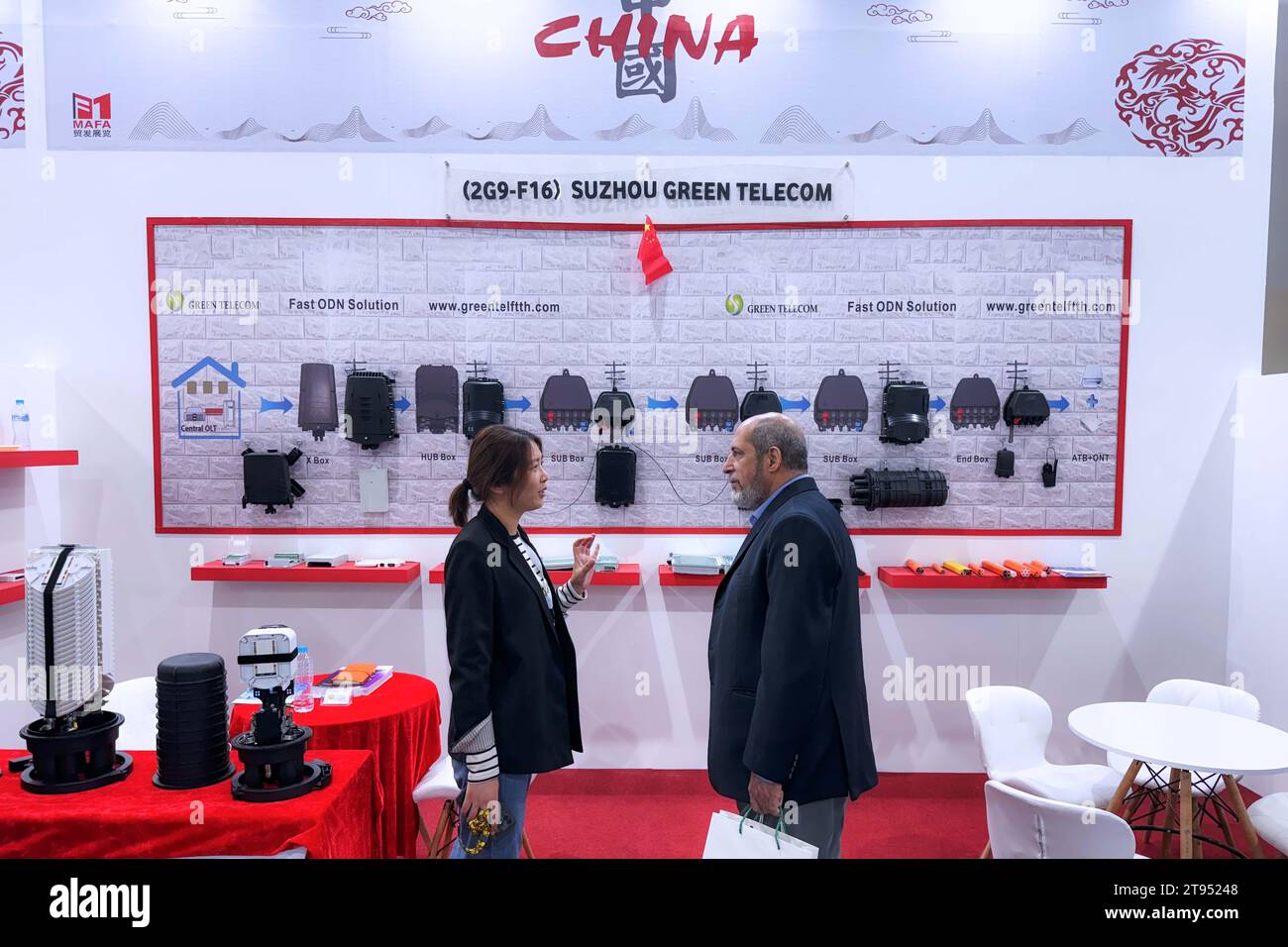 Cairo, Egypt. 21st Nov, 2023. A visitor talks with an exhibitor at the ...
