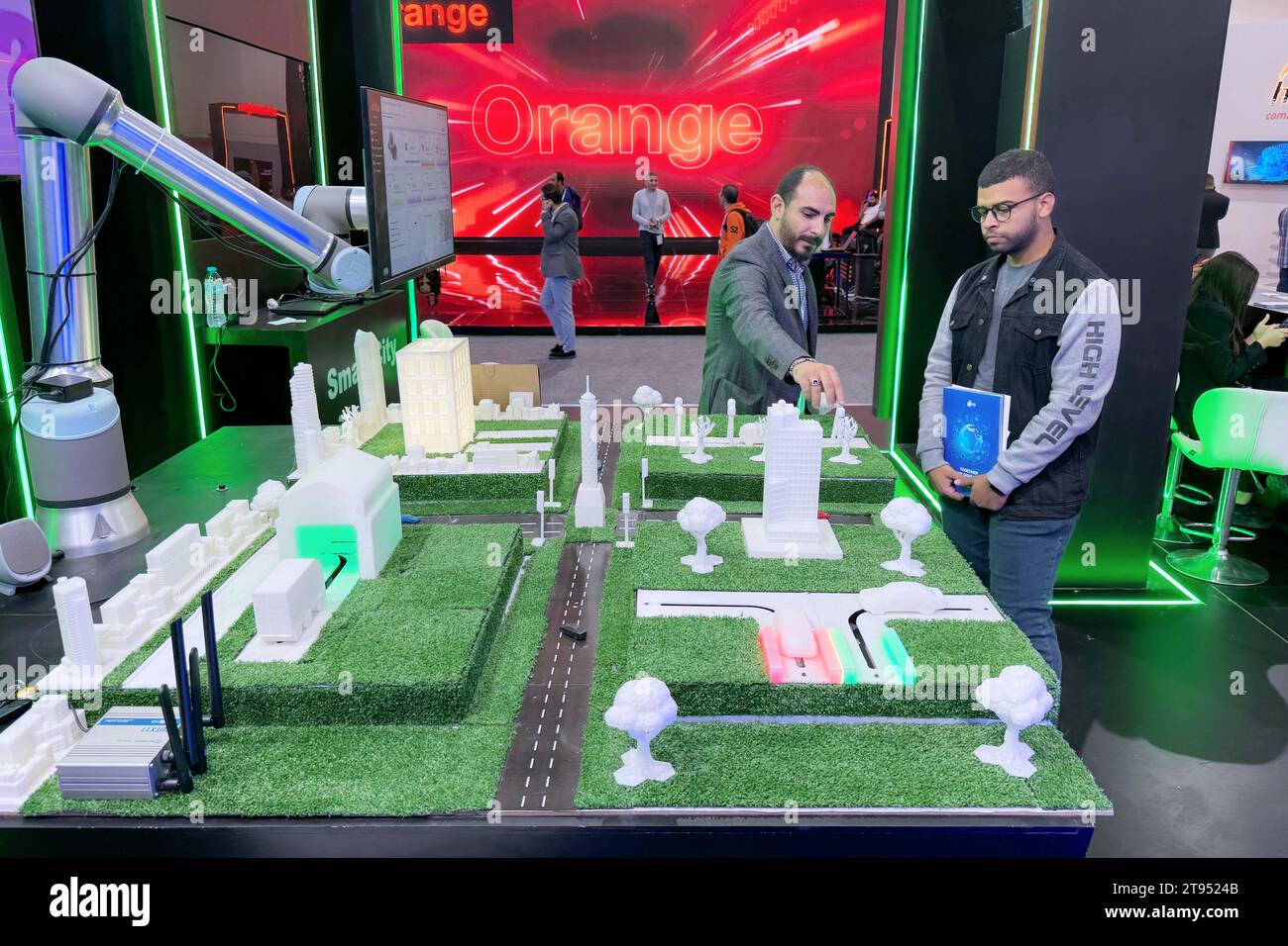 Cairo, Egypt. 21st Nov, 2023. People look at a model at the Cairo ICT ...