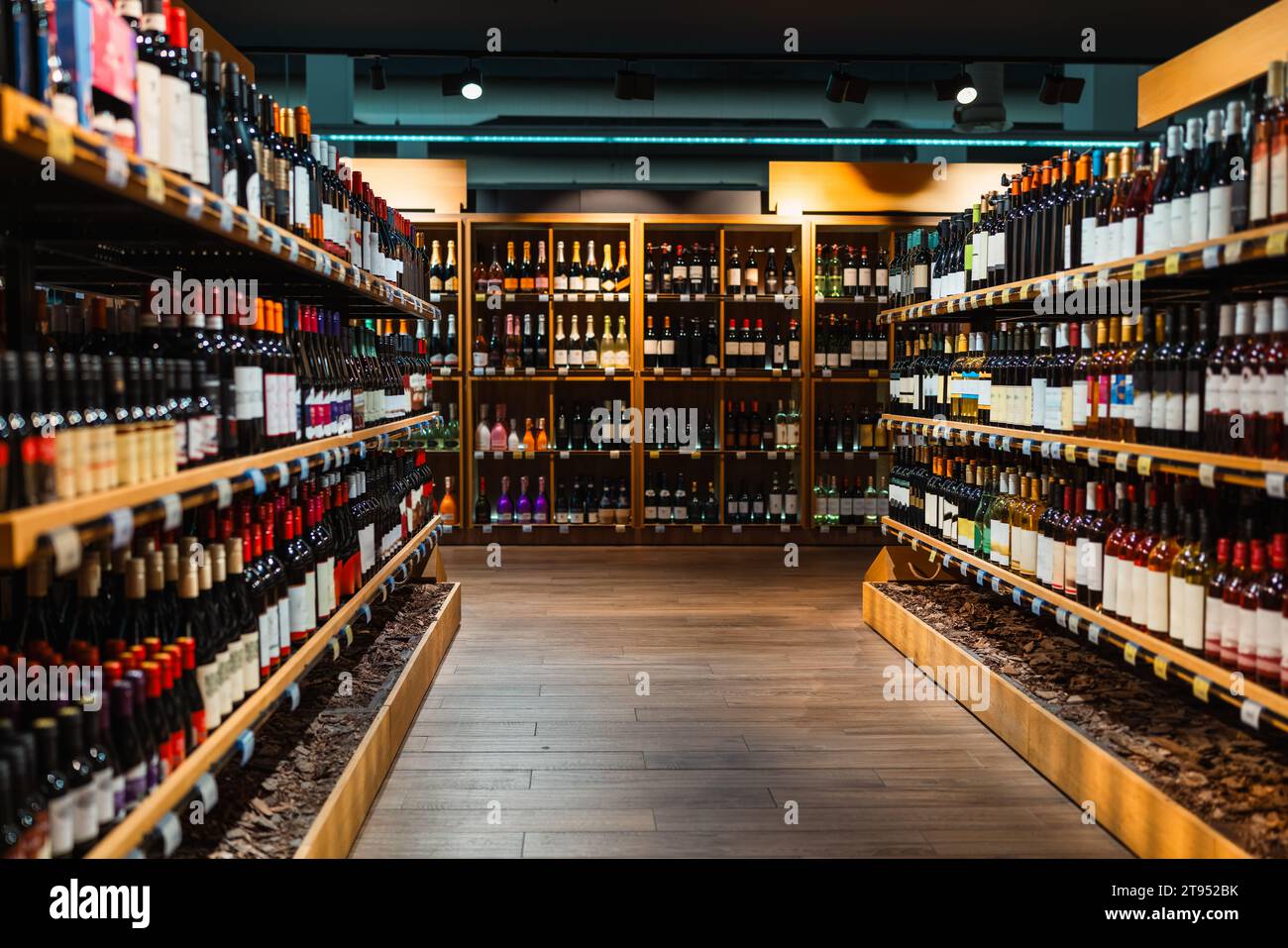 Liquor store background. Alcohol retail industry. Wine bottles on ...