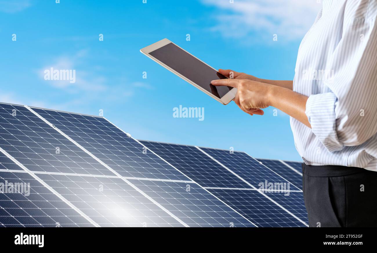 Female person wearing formal outfit controls the solar energy station ...
