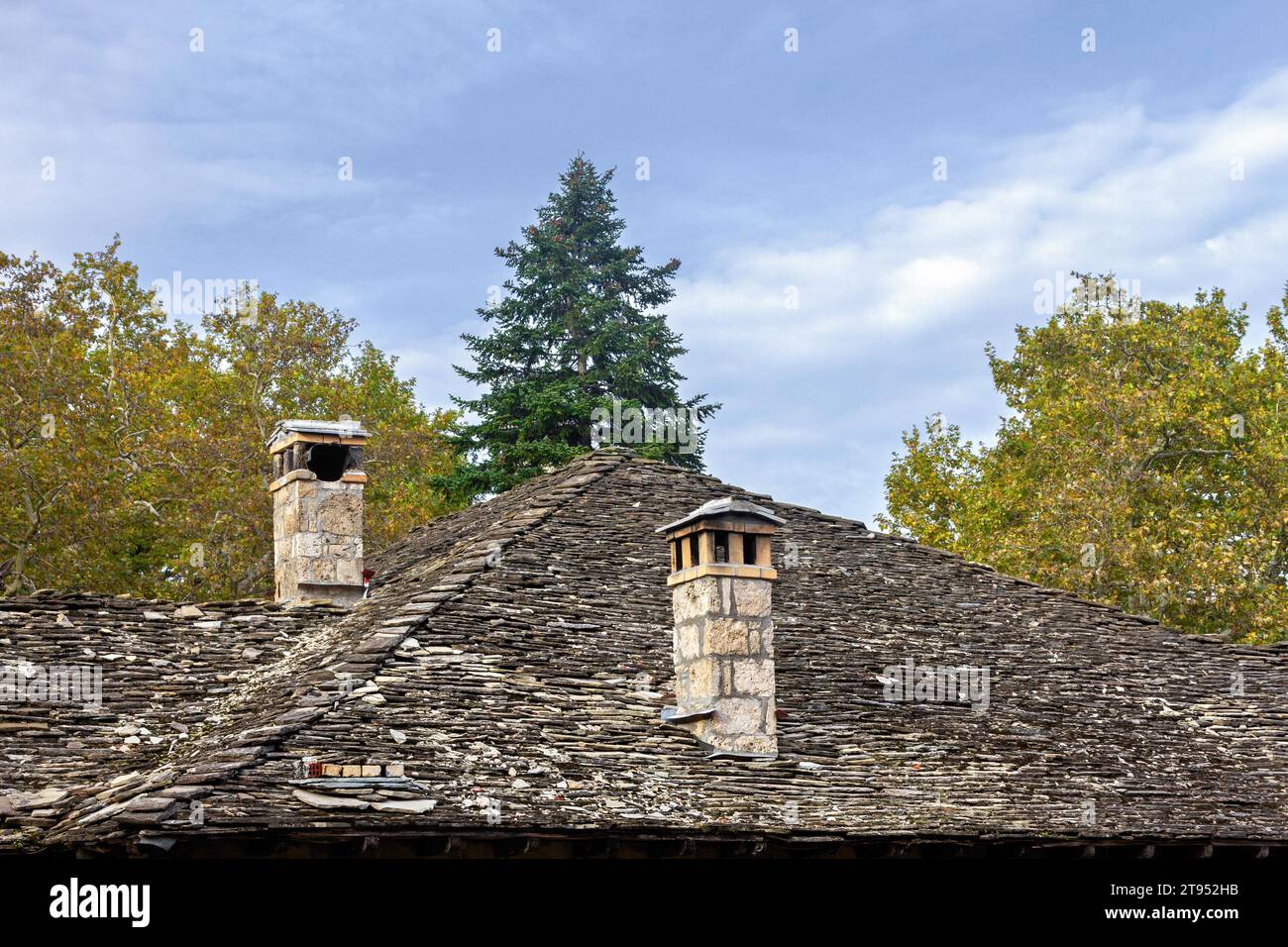 Traditional house with stonelime roof tiles, a local architecture style ...