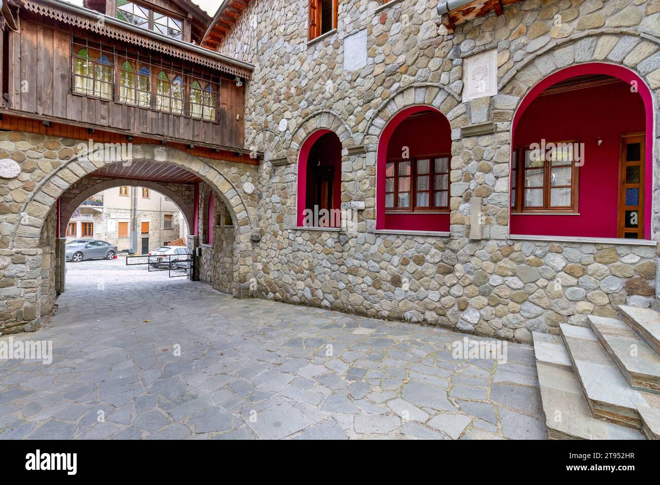 Traditional stone architecture with arch and wooden parts, in Metsovo ...