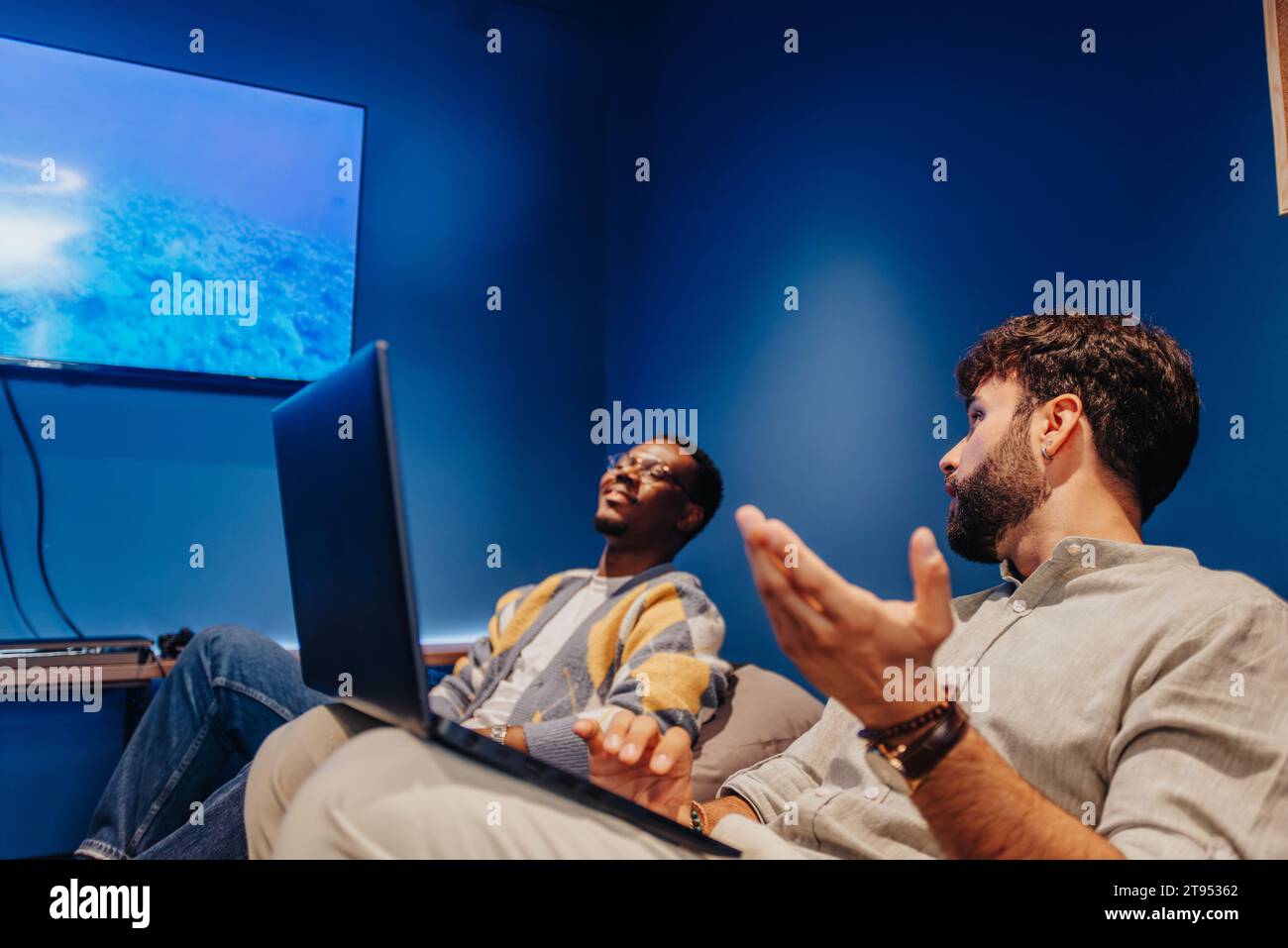 Dynamic Collaboration in a Multi-Generational Workspace Stock Photo - Alamy