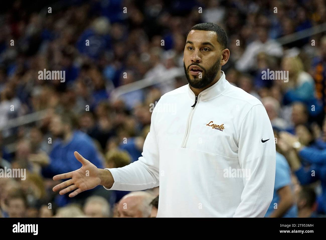 Loyola Chicago head coach Drew Valentine talks to his players during ...