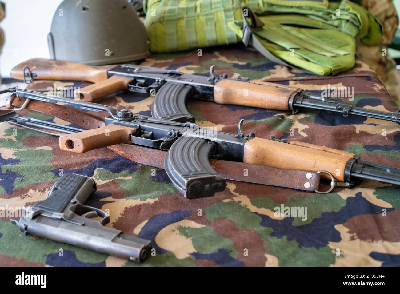 Two old Kalashnikov assault rifles with military equipments Stock Photo ...