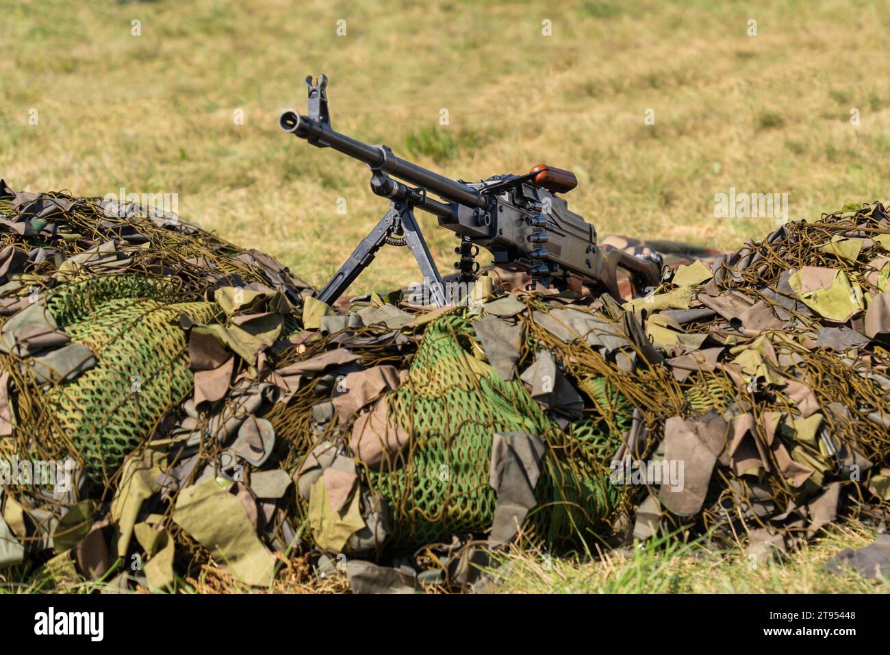 Soviet-made PK machine gun and camouflage netting.. "Kalashnikov's ...