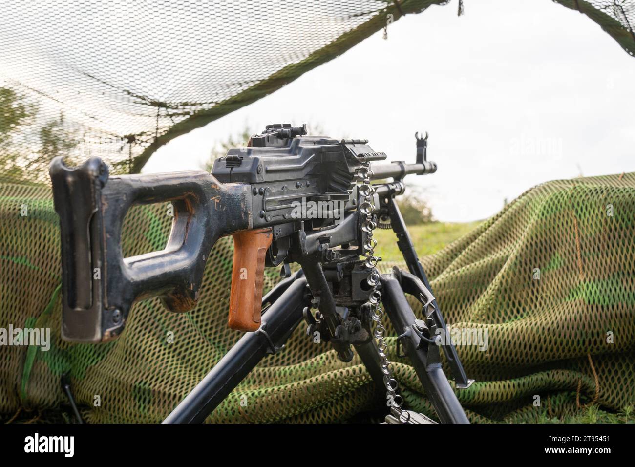 Soviet-made PK machine gun and camouflage netting.. "Kalashnikov's ...