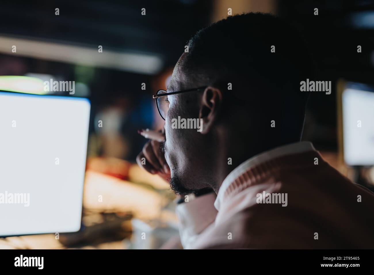 A diverse team working late at night to meet a project deadline ...