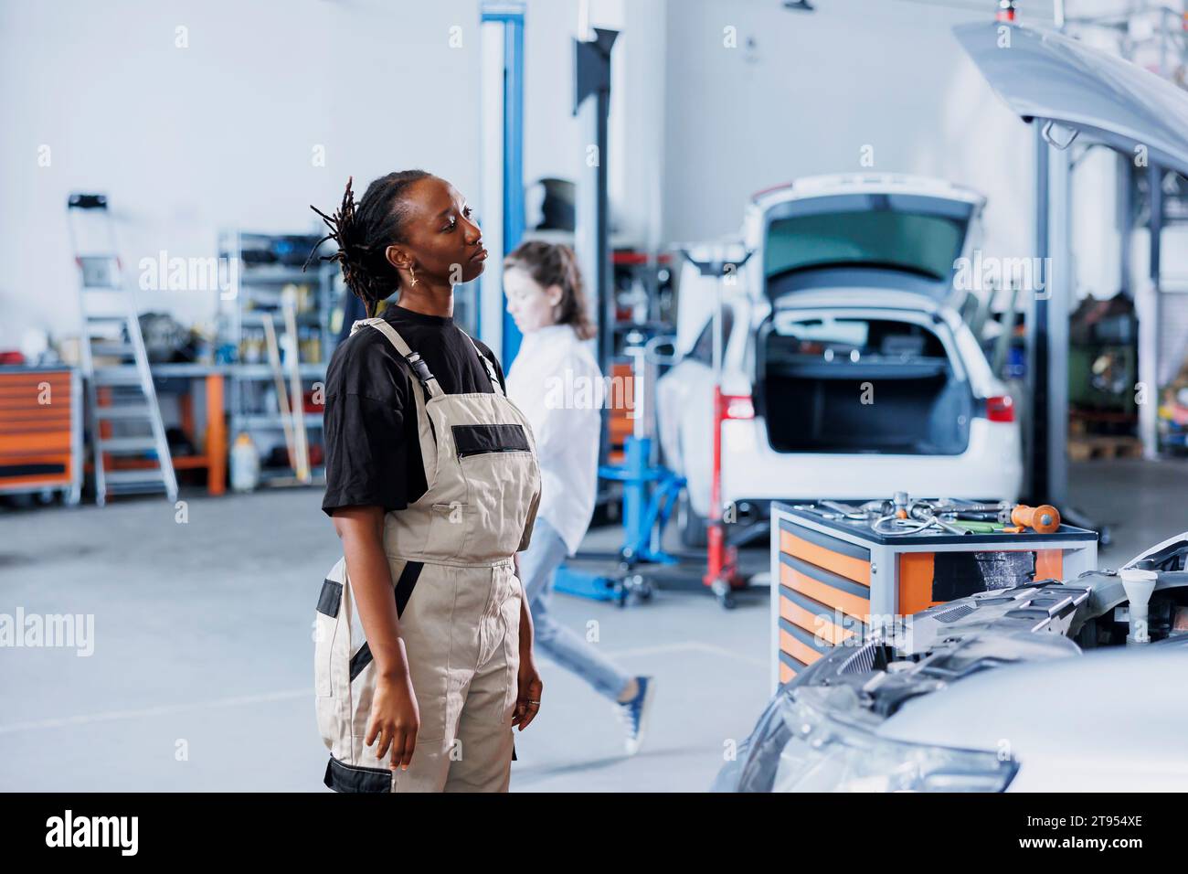 Knowledgeable repair shop employee uses augmented reality to visualize ...