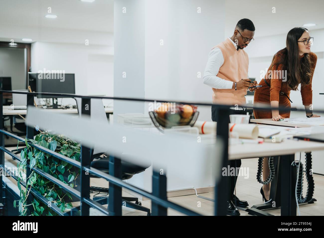Multiracial corporate team collaborating in a creative office ...