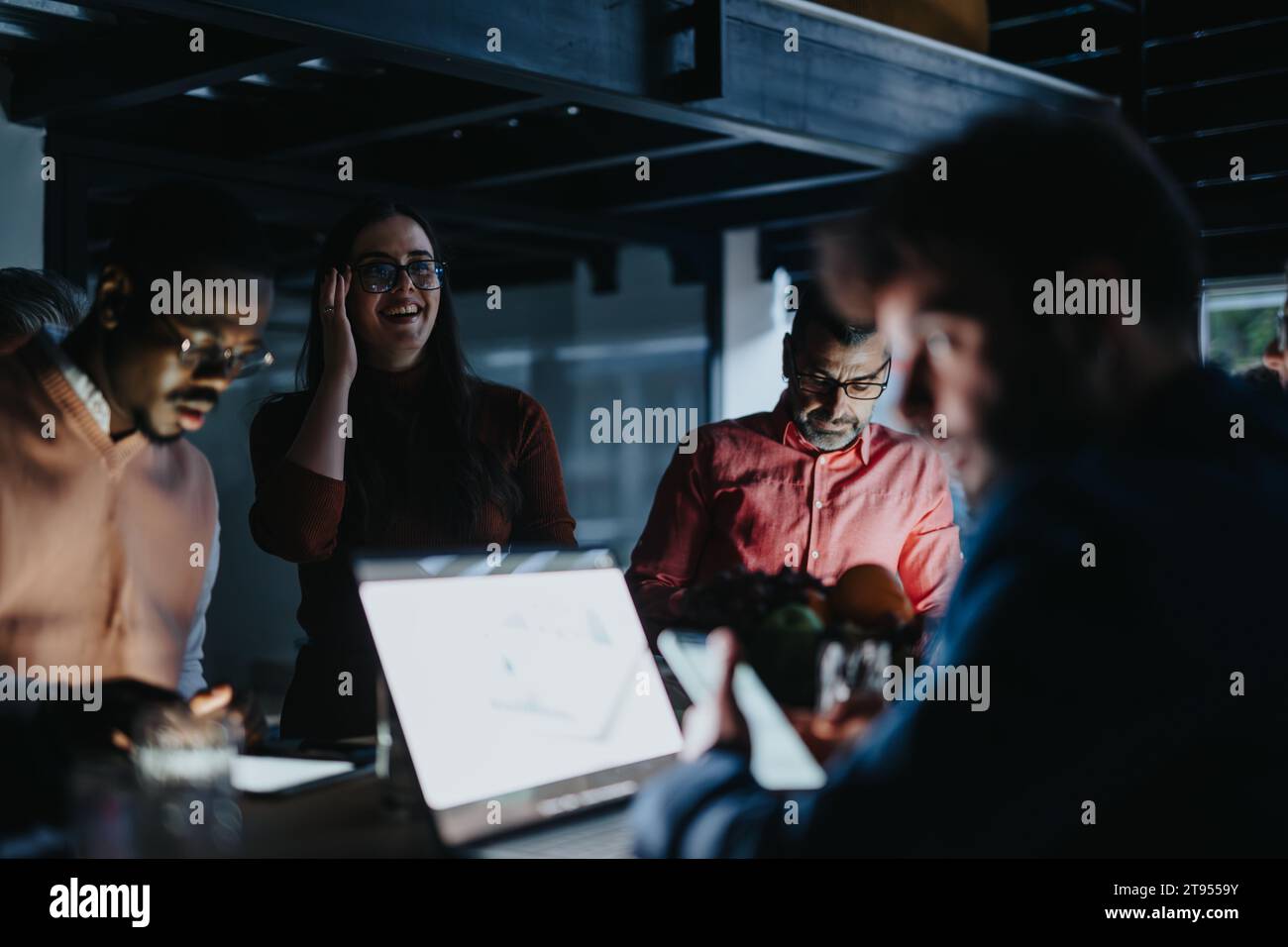 Business Team Collaborating Late at Night on Project Development and ...