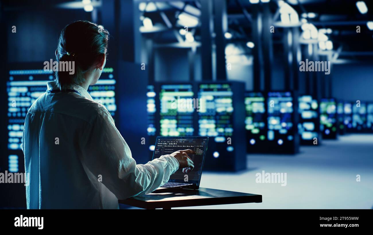 Asian System Administrator Running Code And Programming On Laptop Troubleshooting And Upgrading