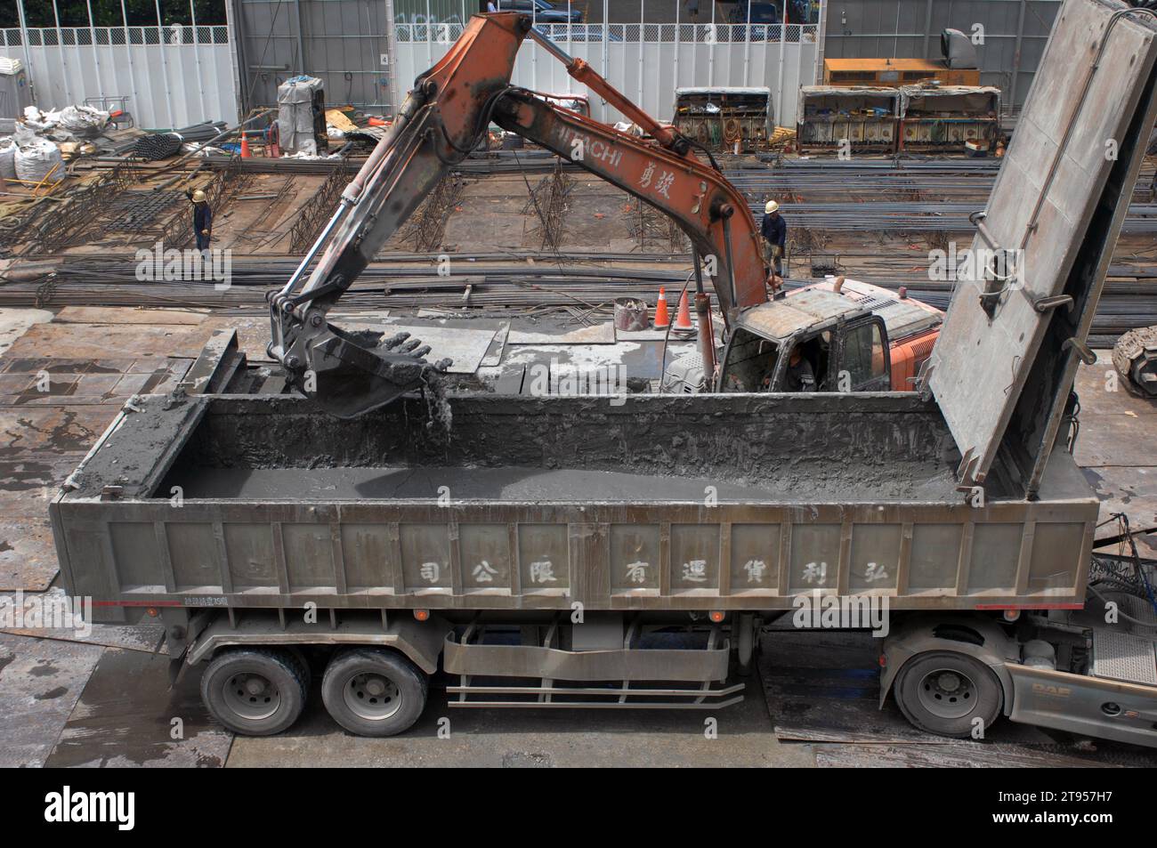 Digger working in a building site during construction of a new office ...