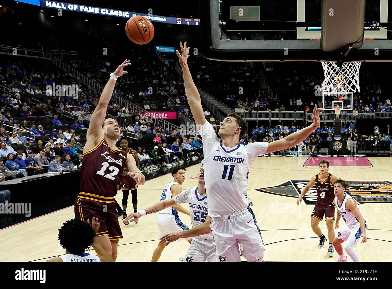 Loyola Chicago guard Greg Dolan (12) shoots over Creighton center Ryan ...