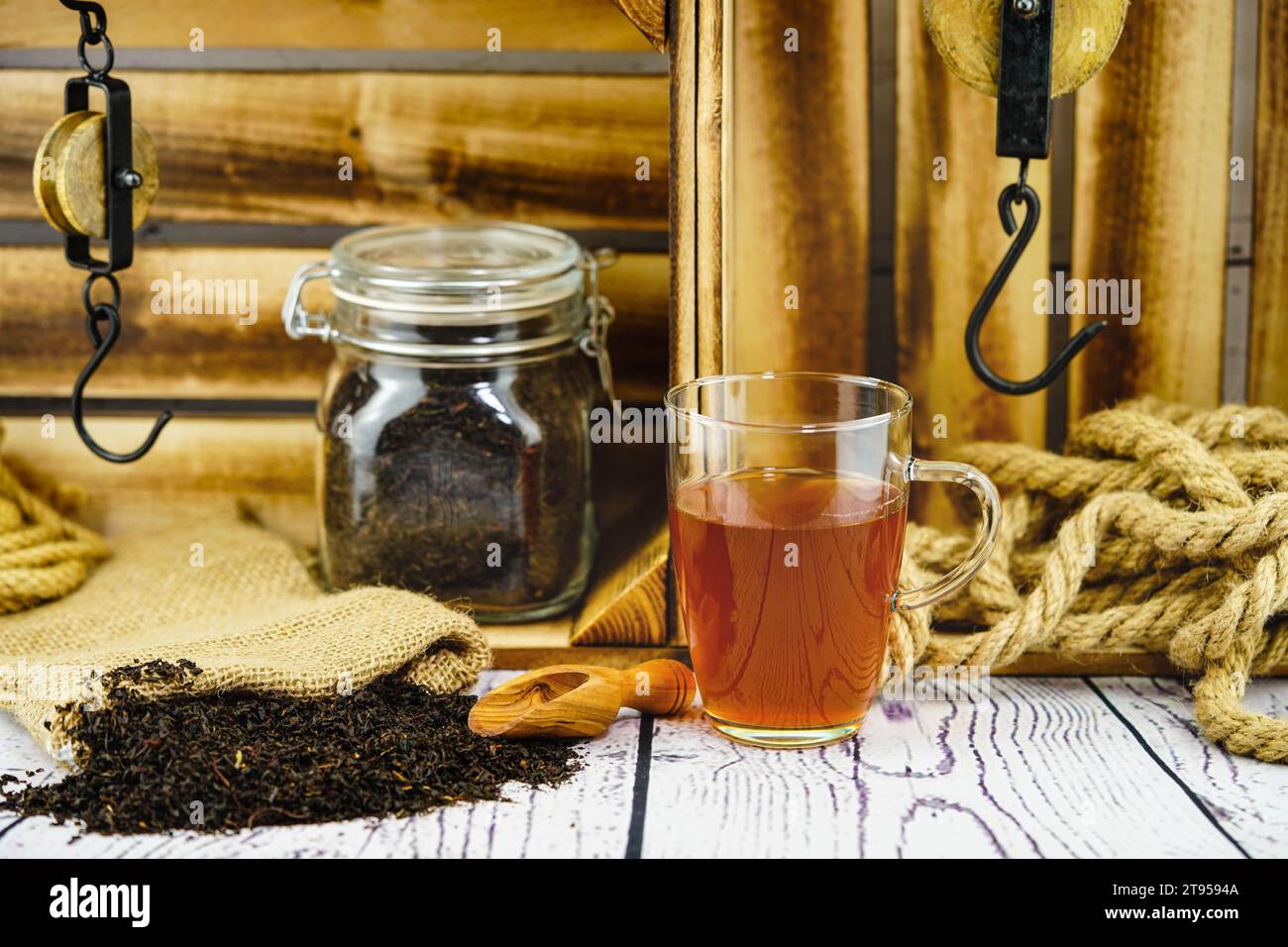dry tea leaves, tea glass, glass jar, sack and rope Stock Photo - Alamy