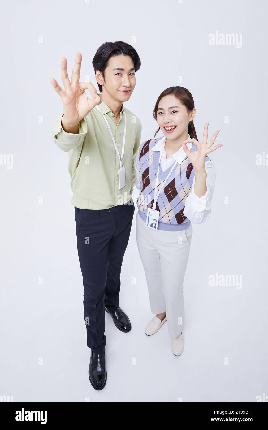 fighting business photo image of young people moving their hands okay ...