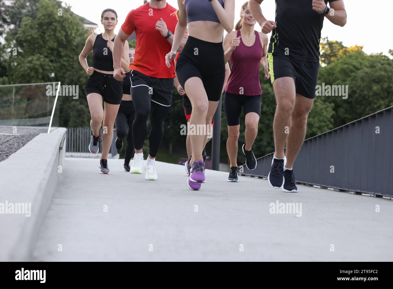 Group of people running outdoors. Active lifestyle Stock Photo - Alamy
