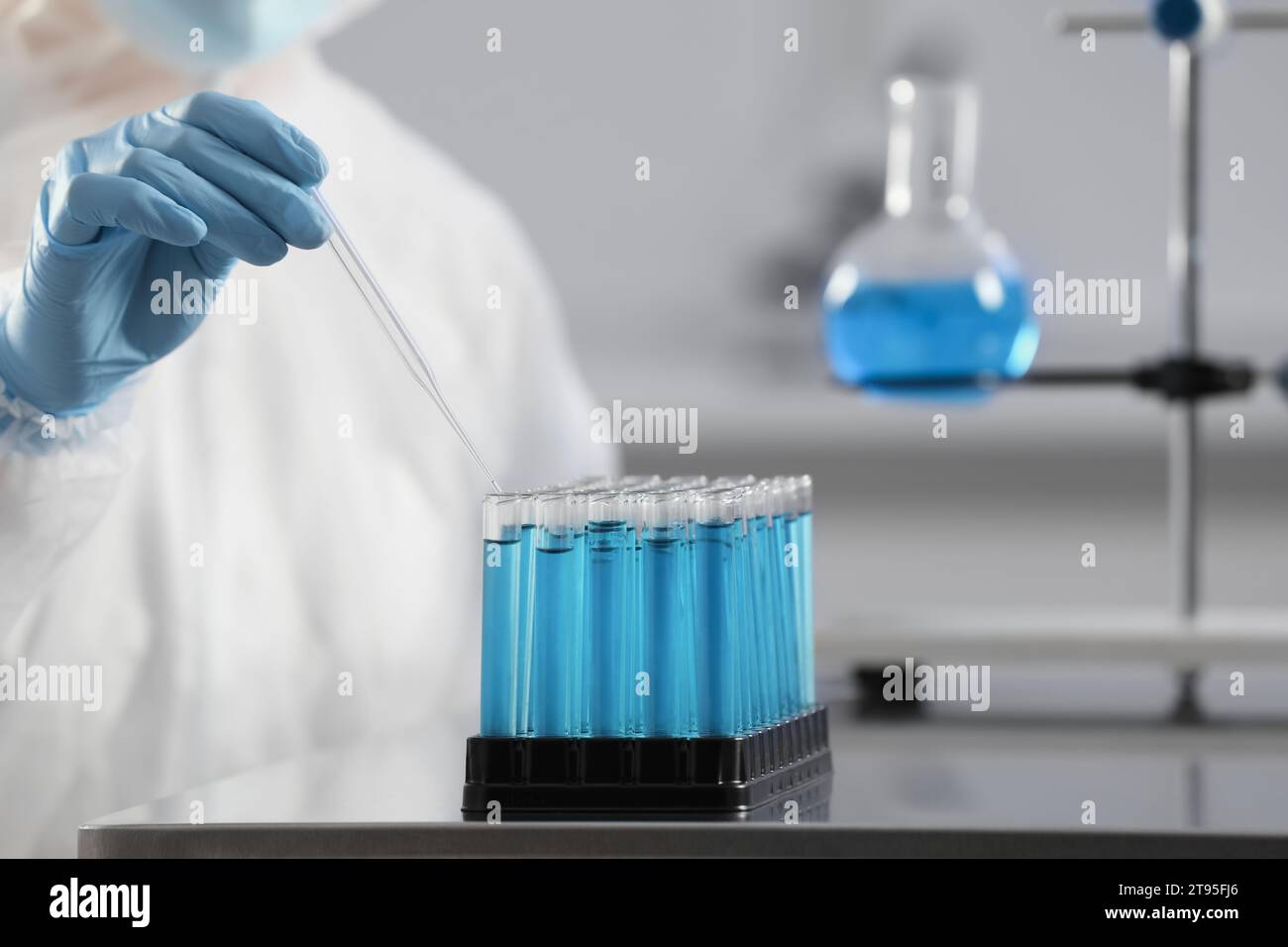 Scientist taking sample blue liquid hi-res stock photography and images ...