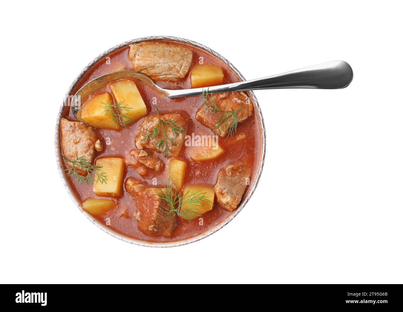 Delicious goulash in bowl isolated on white, top view Stock Photo - Alamy