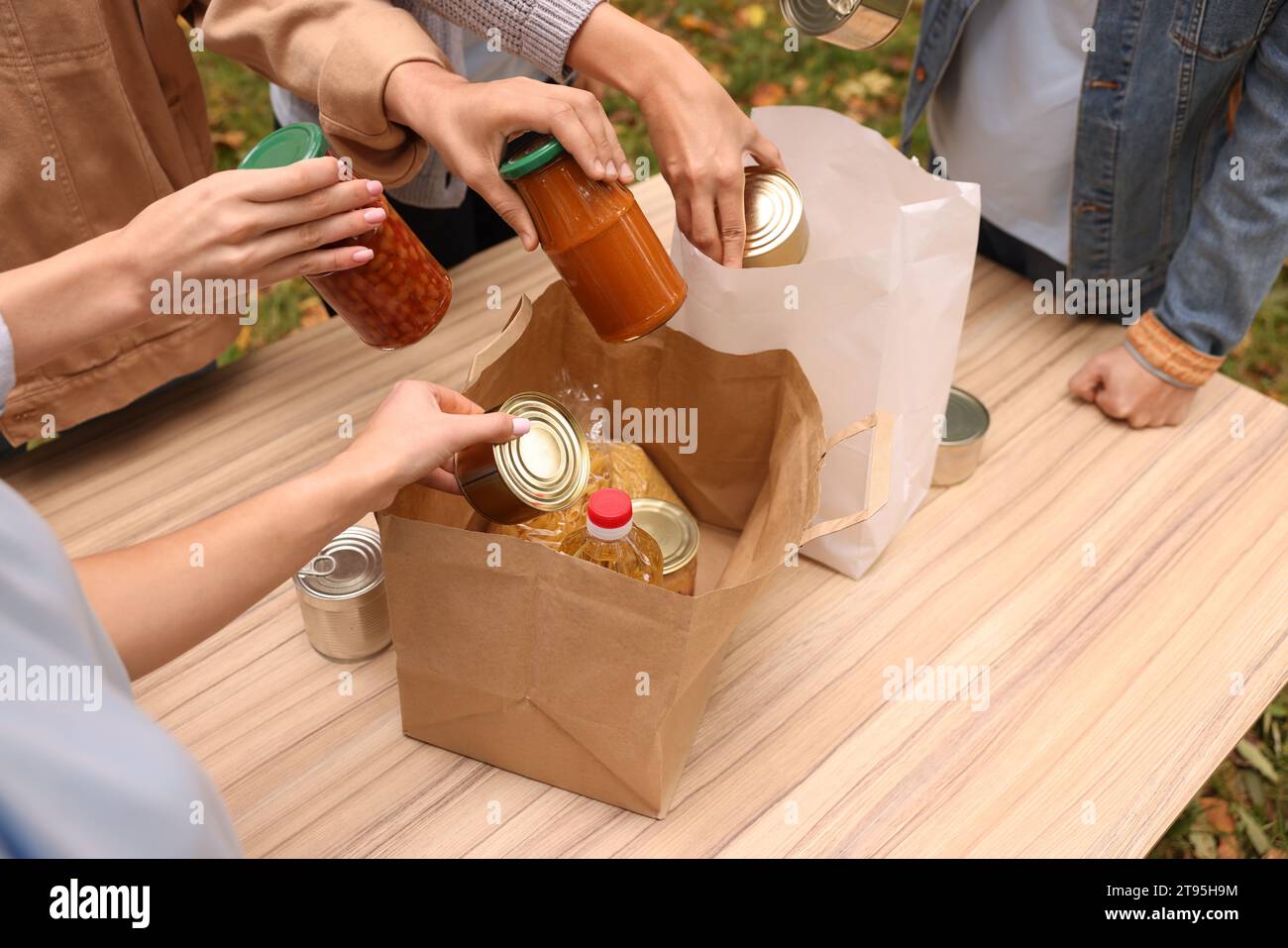 Group young volunteers packing hi-res stock photography and images - Alamy