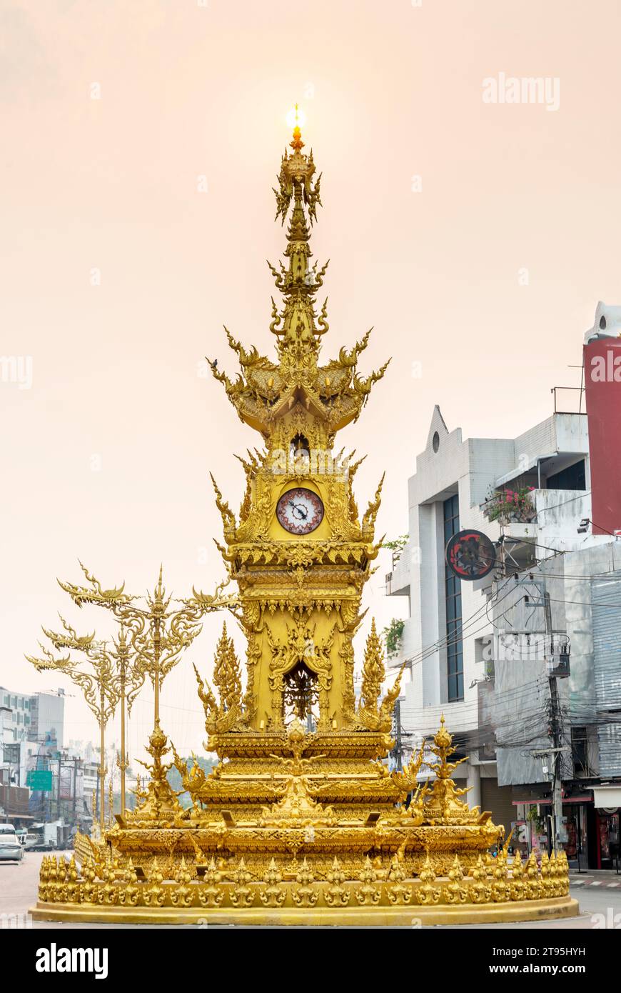 The sun touching the top of golden,historical,beautiful ornate clock ...