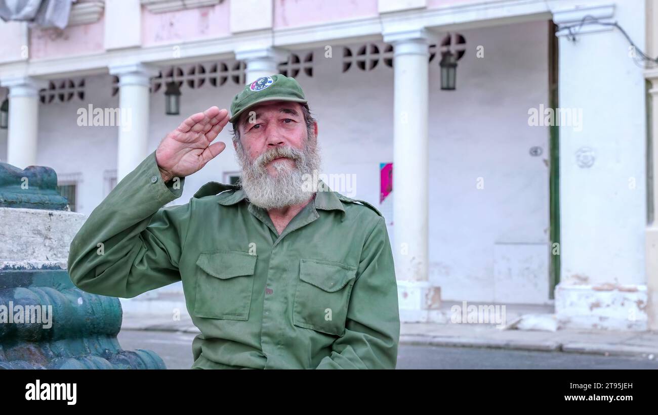 elderly man with a striking resemblance to fidel castro poses for ...