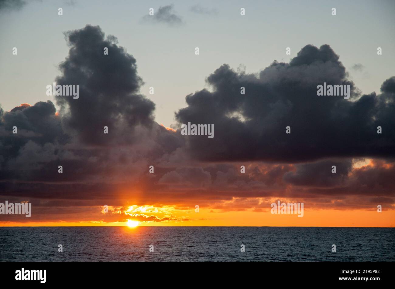Tropical sunset at sea, off the Solomon Islands in the South Pacific ...