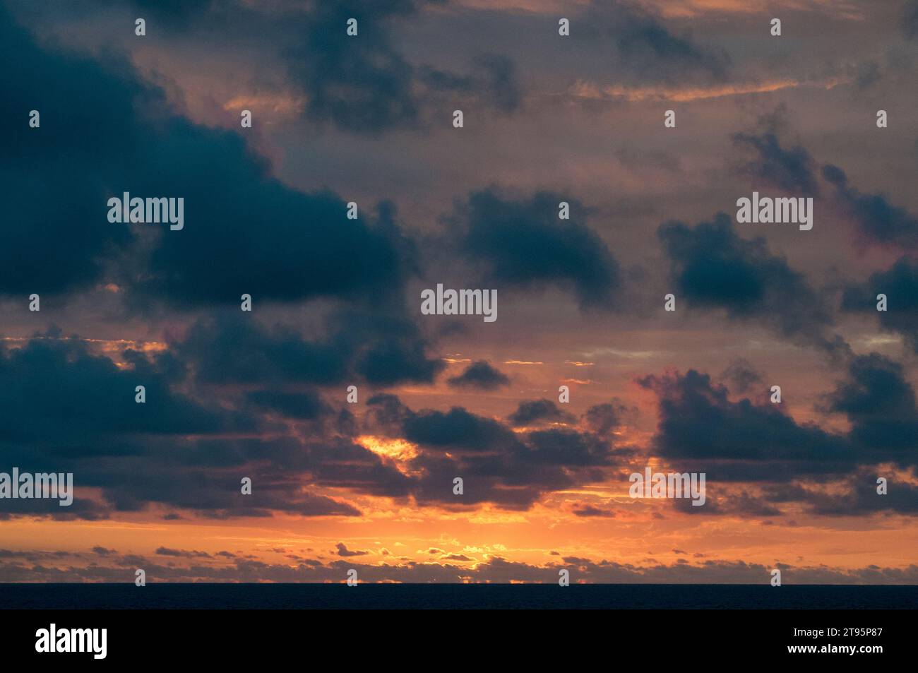 Tropical sunset at sea, off the Solomon Islands in the South Pacific ...