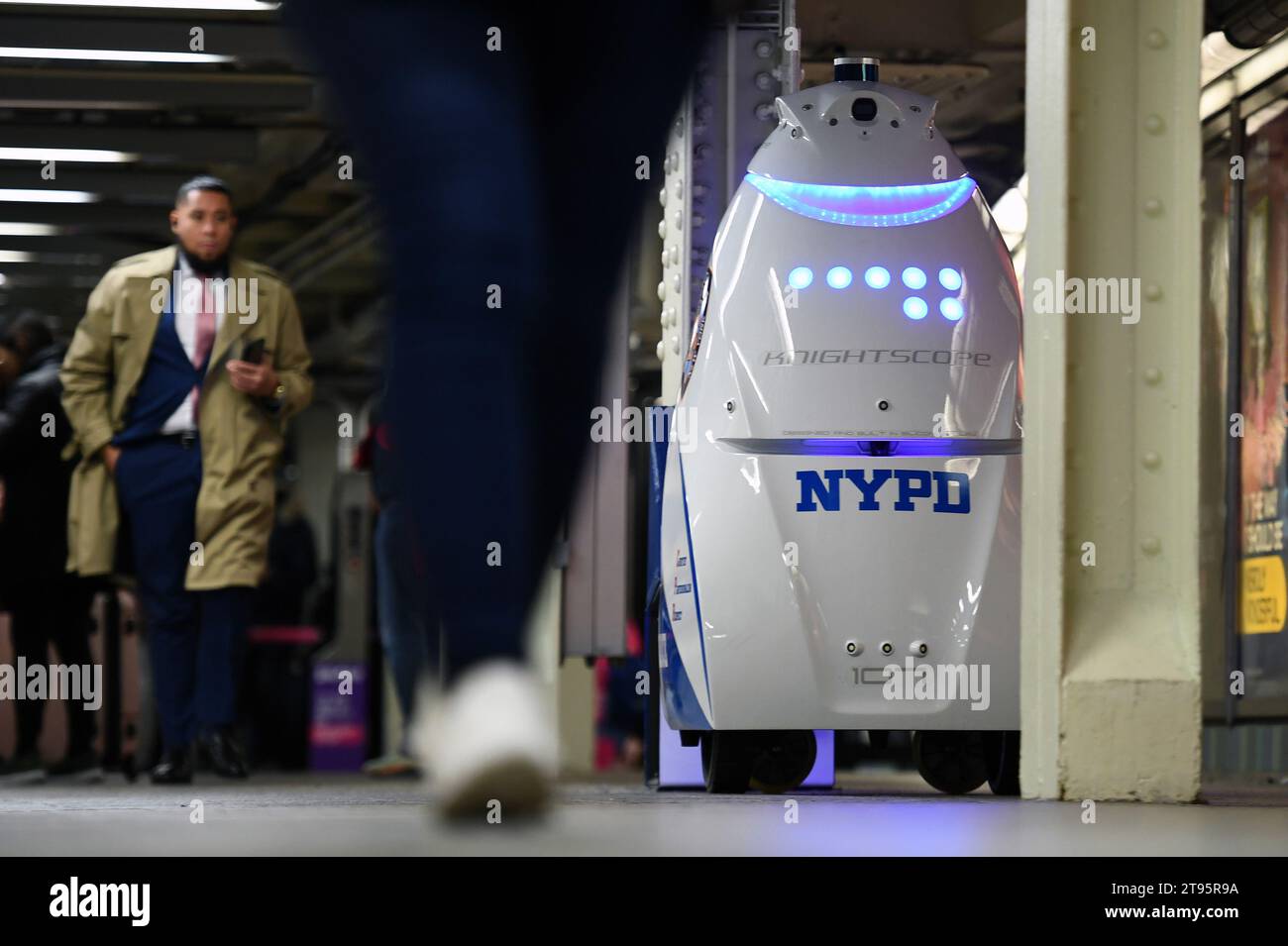 New York, USA. 22nd Nov, 2023. Commuters walk past the NYPD's ...