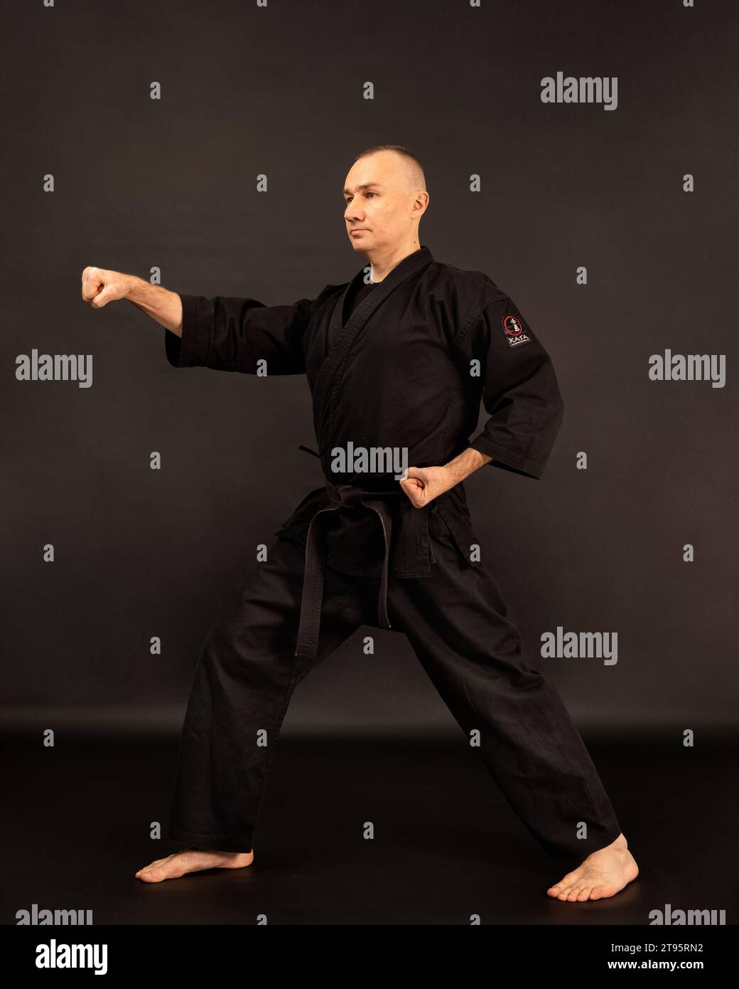 Portrait of aikido sensei master with black sensei belt in taekwondo ...