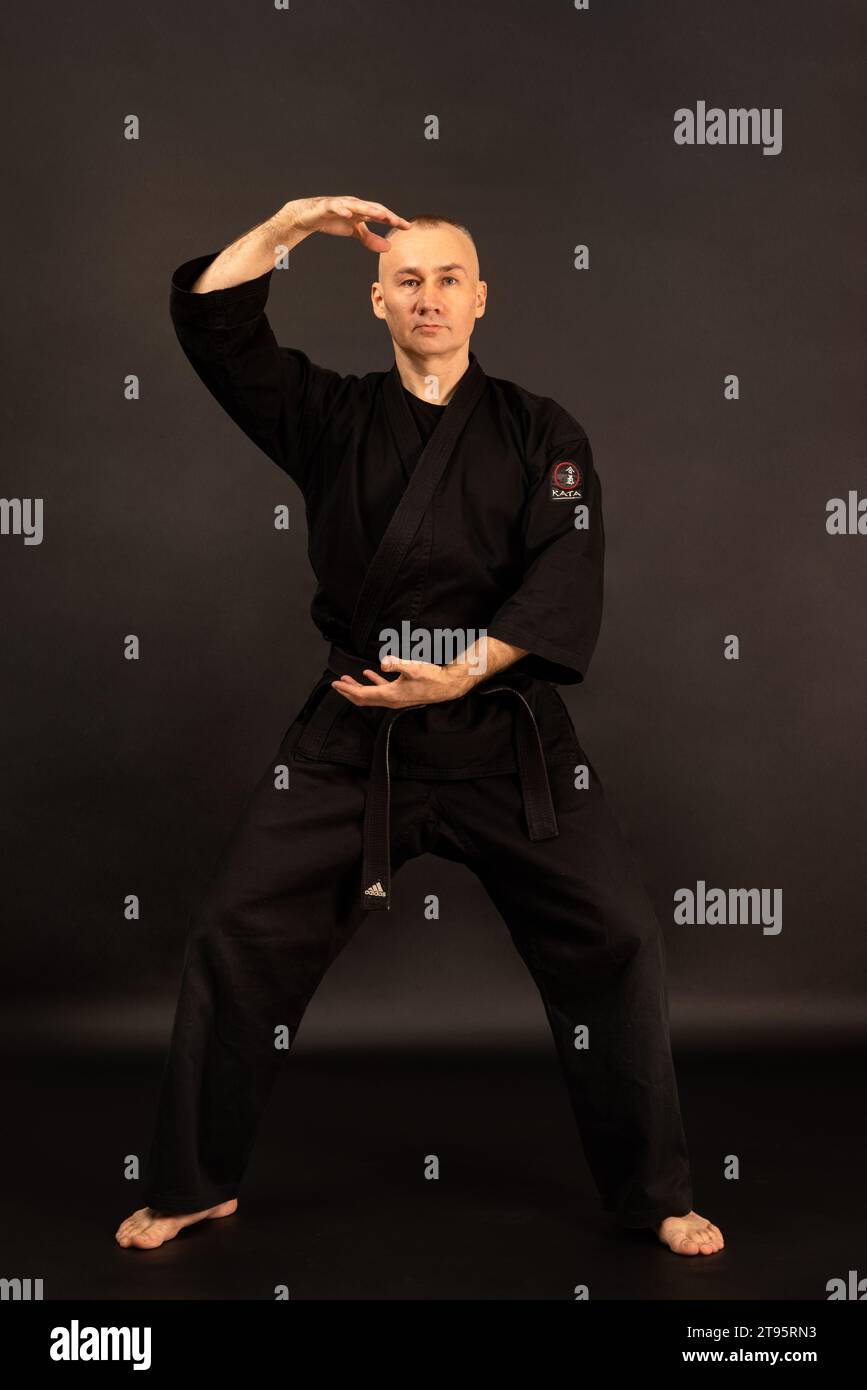 Portrait of aikido sensei master with black sensei belt in taekwondo ...