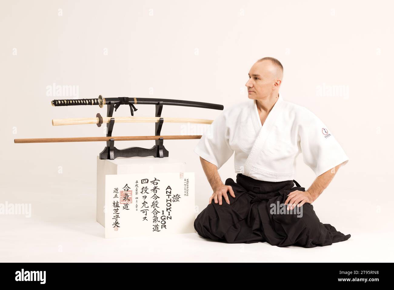 Portrait of aikido sensei master with black sensei belt in taekwondo ...