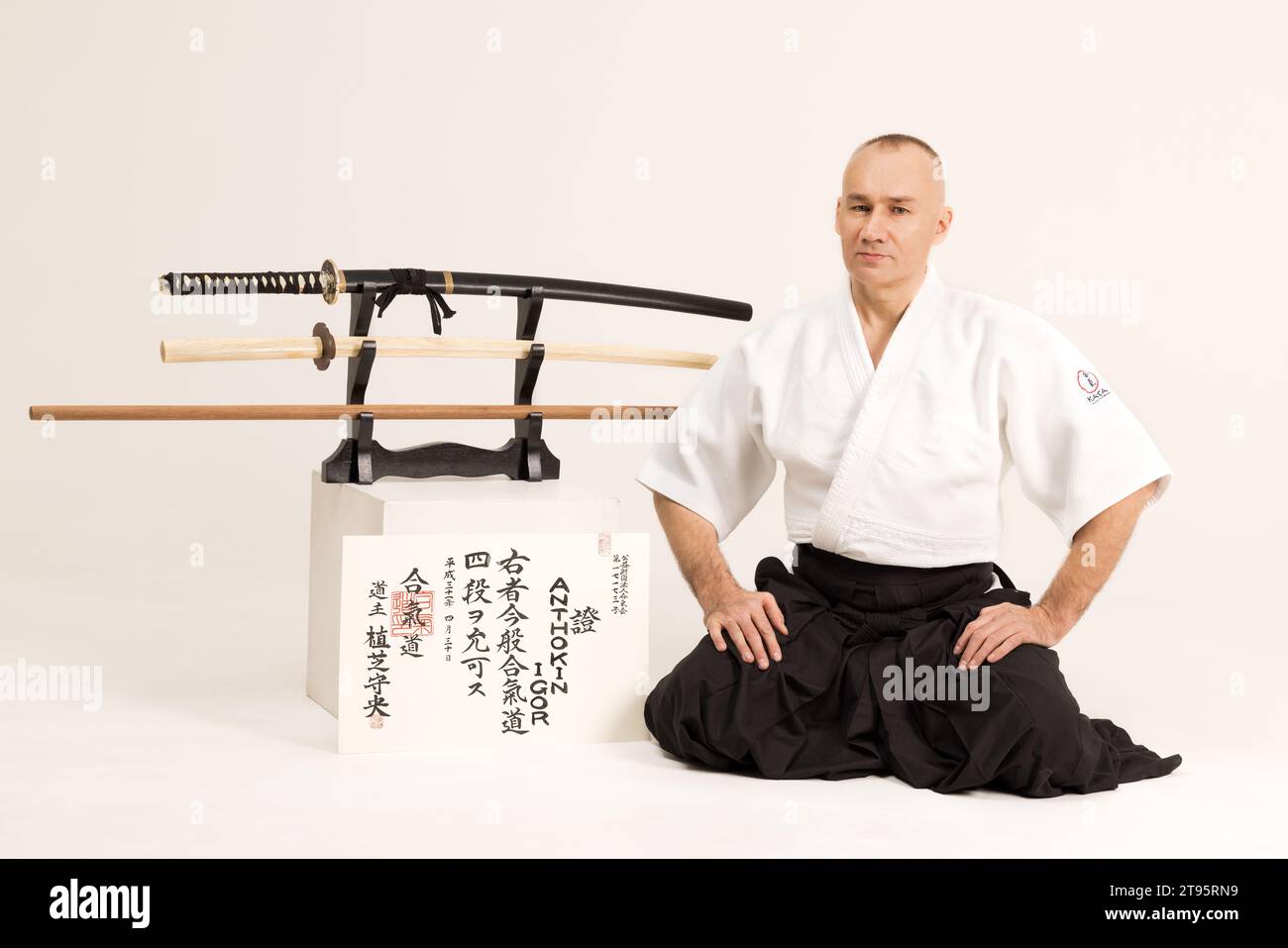Portrait of aikido sensei master with black sensei belt in taekwondo ...