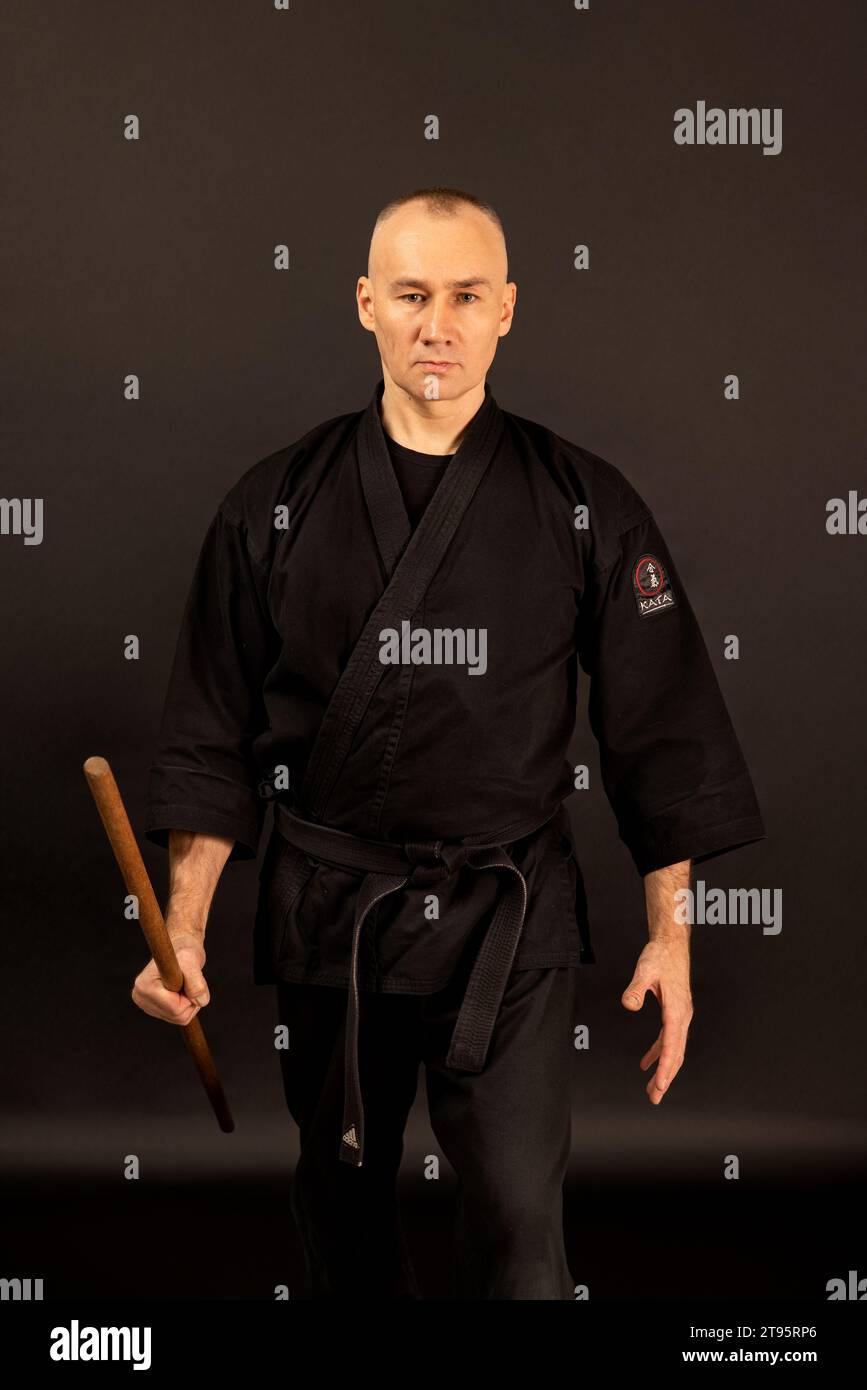 Portrait of aikido sensei master with black sensei belt in taekwondo ...