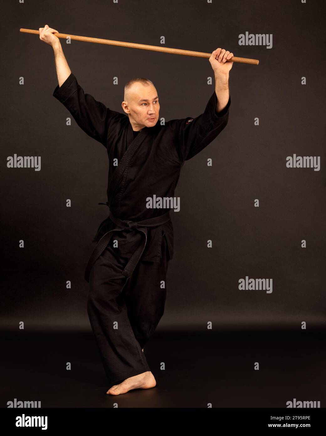 Portrait of aikido sensei master with black sensei belt in taekwondo ...