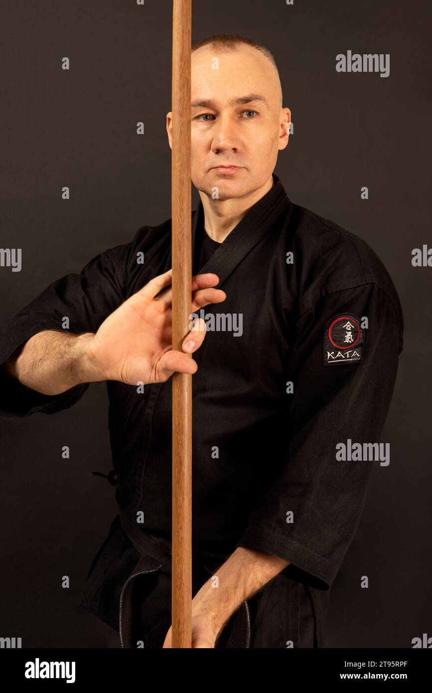 Portrait of aikido sensei master with black sensei belt in taekwondo ...