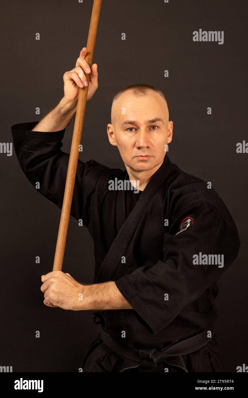 Portrait of aikido sensei master with black sensei belt in taekwondo ...