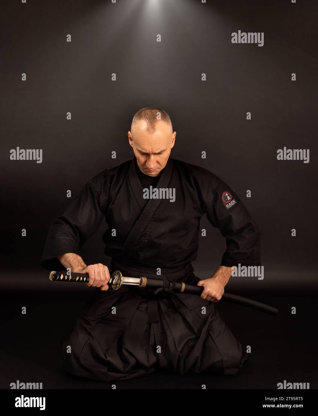 Portrait of aikido sensei master with black sensei belt in taekwondo ...